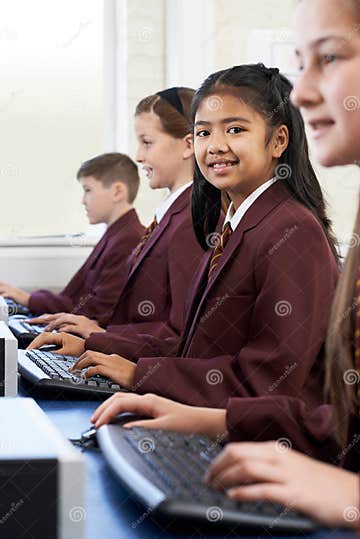 Pupils Wearing School Uniform in Computer Class Stock Image - Image of ...
