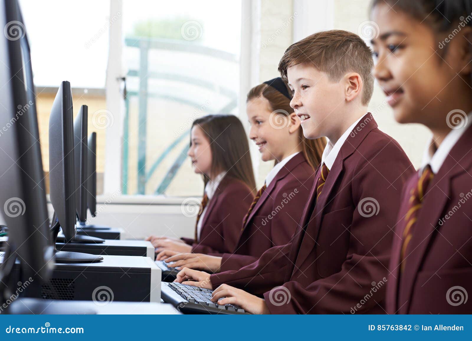 Pupils Wearing School Uniform In Computer Class Royalty-Free Stock ...