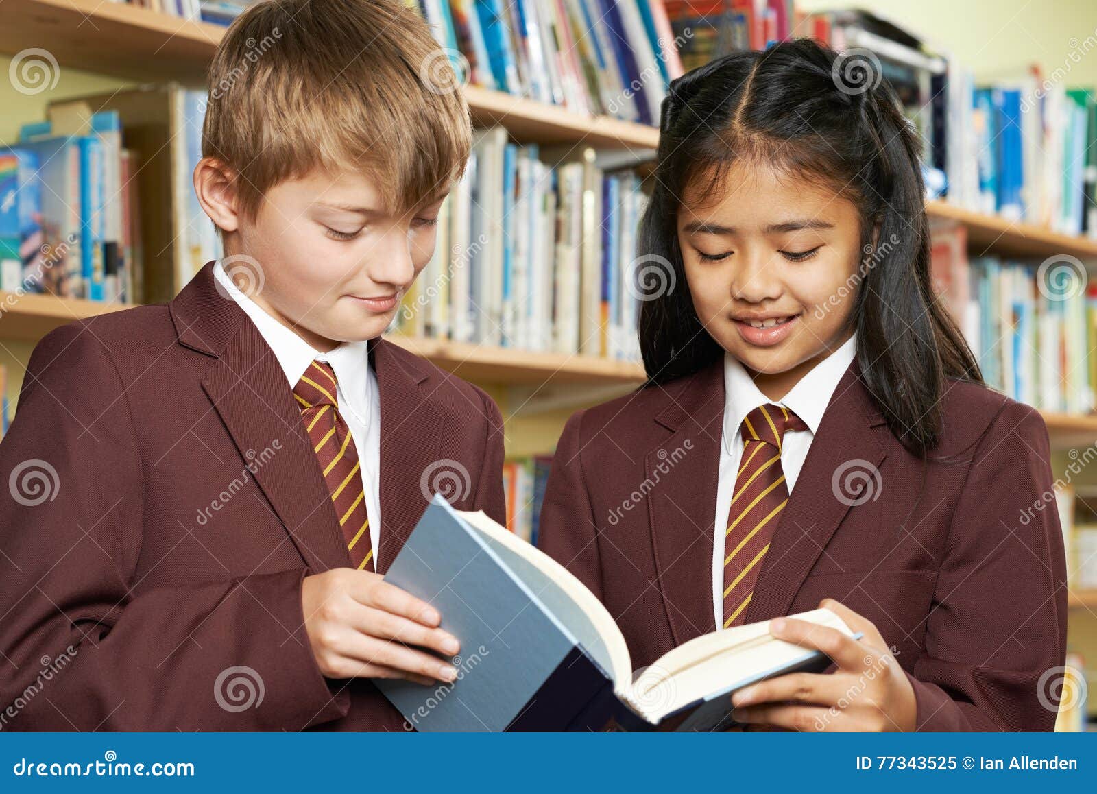Pupils Wearing School Uniform Reading Book in Library Stock Image ... Pupils Wearing School Uniform Reading Book in Library Stock Image ...