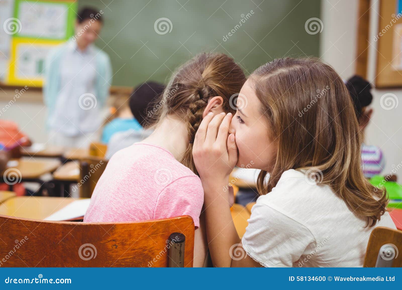 Pupils Whispering Secrets during Class Stock Photo - Image of classroom ...