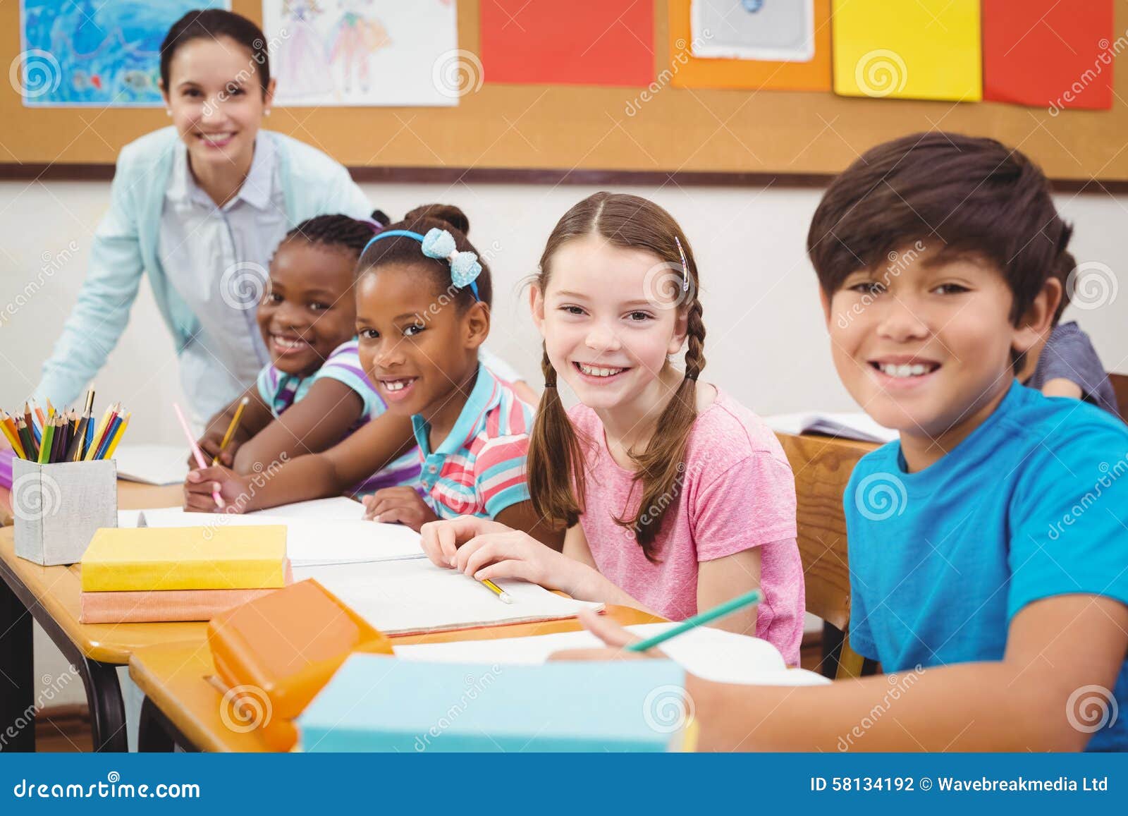 Pupils Working at Their Desks in Class Stock Photo - Image of ...