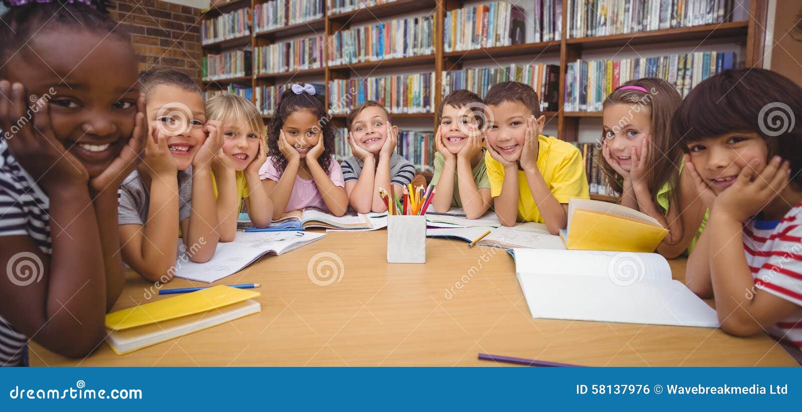 Pupils Working Together at Desk in Library Stock Photo - Image of male ... Pupils Working Together at Desk in Library Stock Photo - Image of male ...