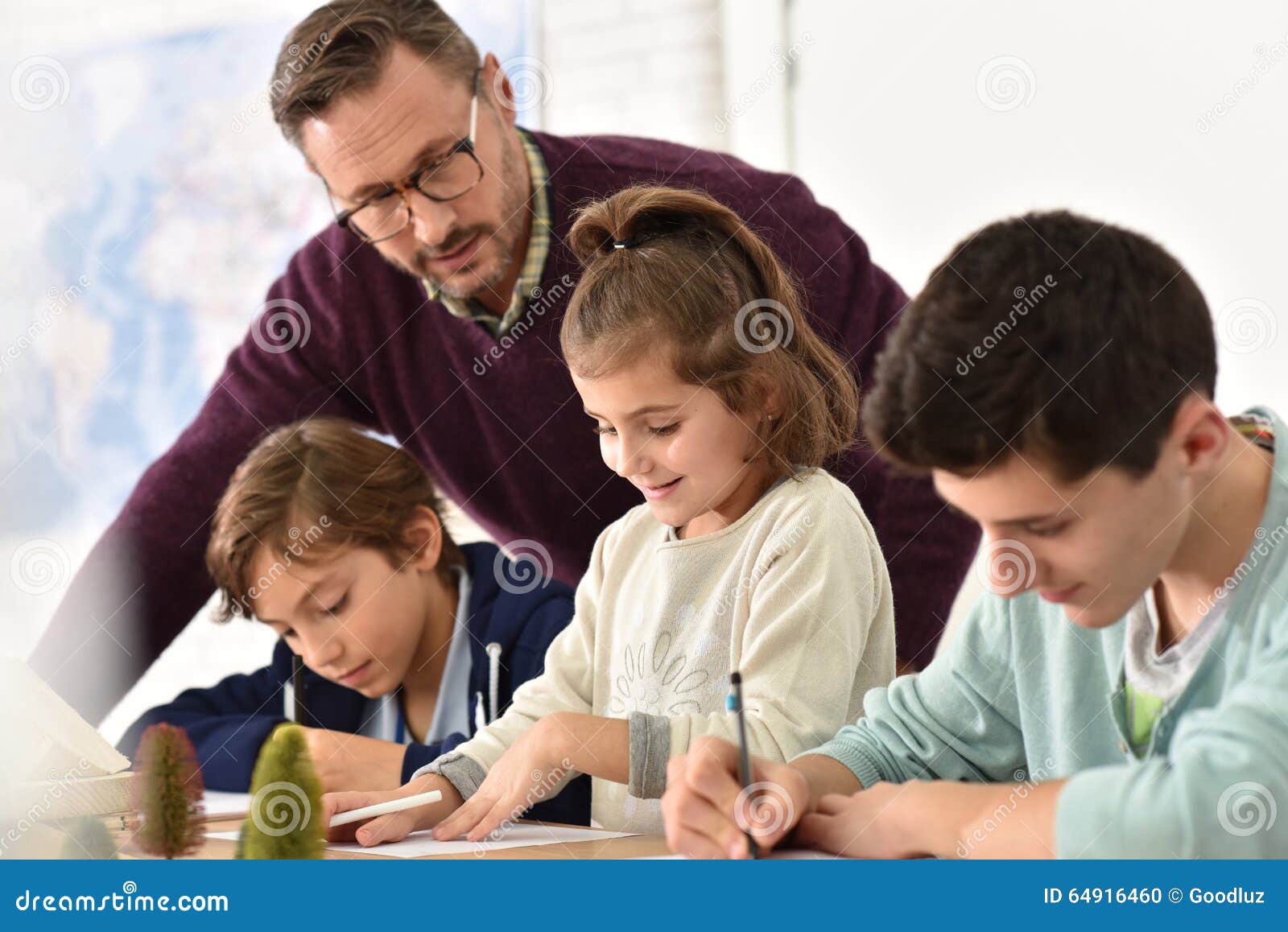 Pupils Writing in Notebooks in Class Stock Photo - Image of primary ...
