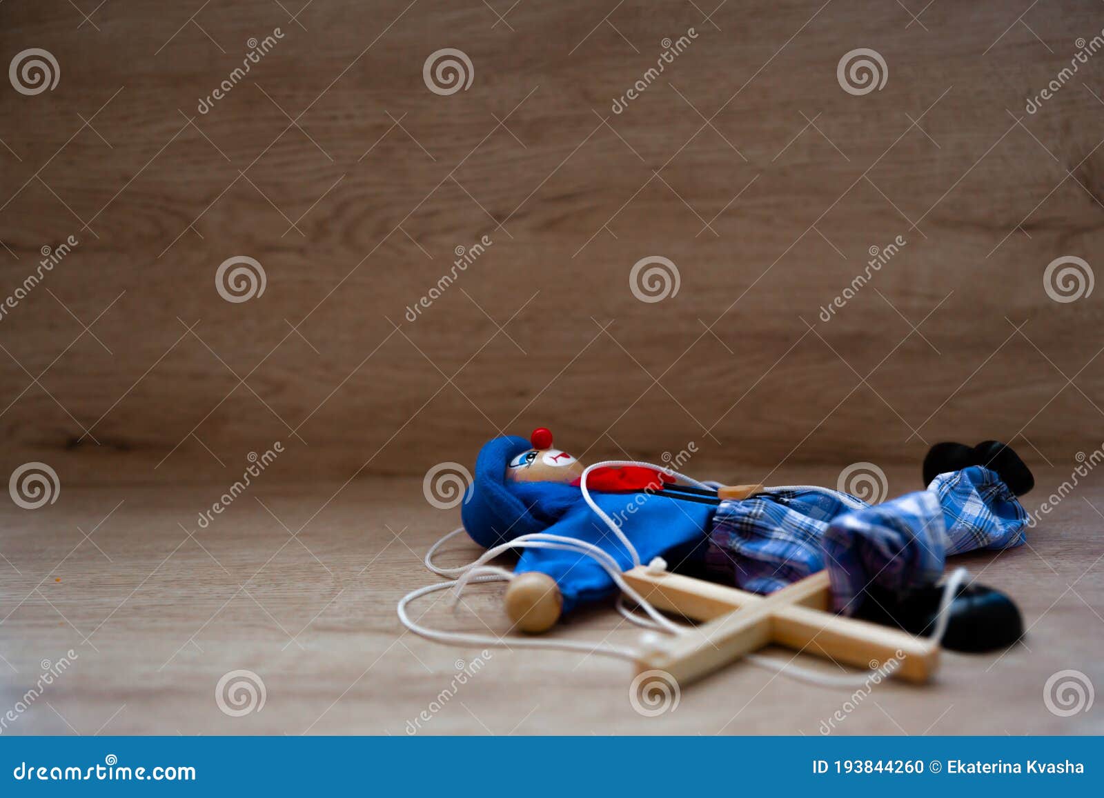 A Puppet-clown, Entangled in Threads and Lying Limp Stock Photo - Image ...