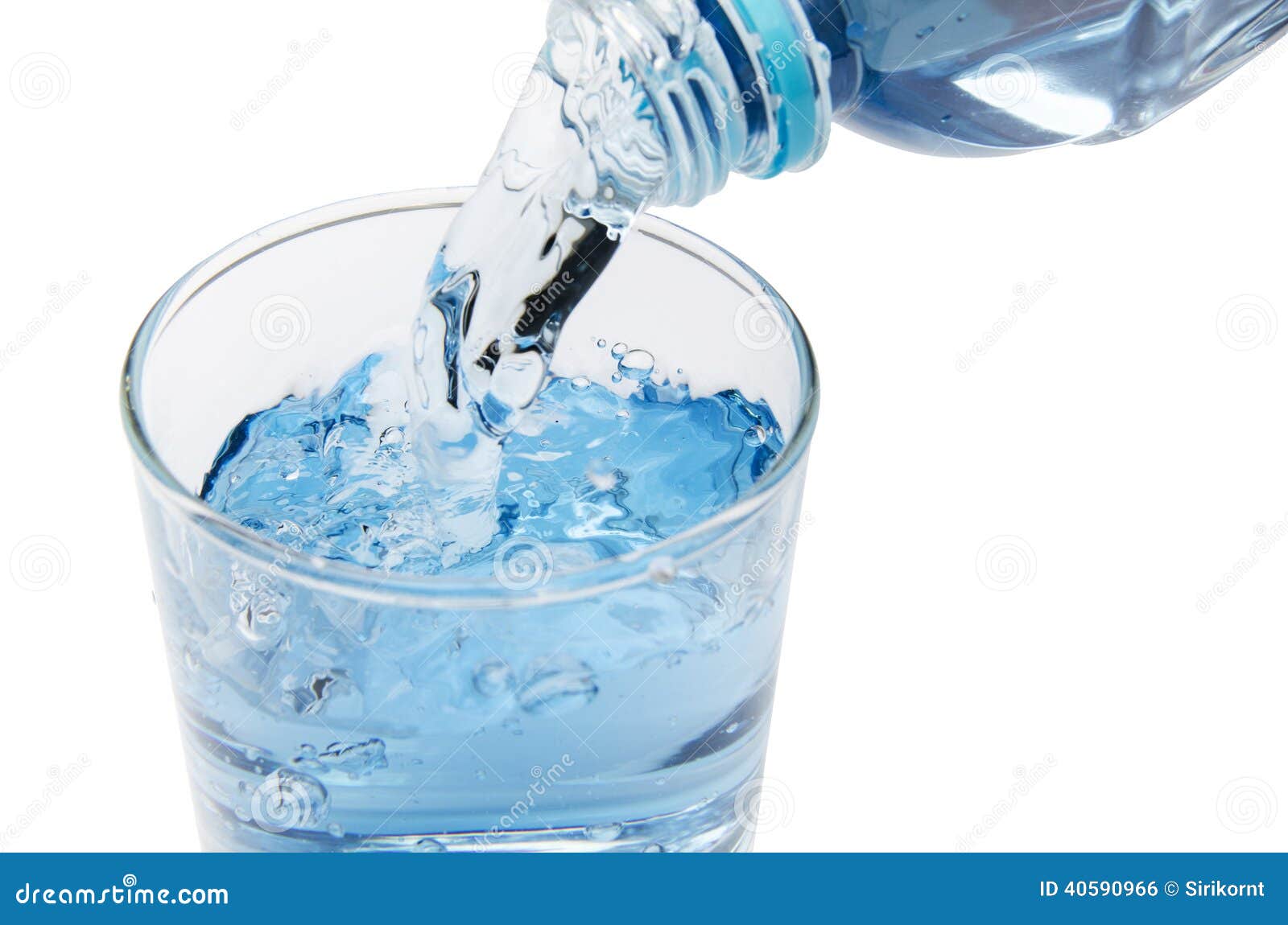 Pure Water is Emptied into a Glass of Water from Bottle Stock Photo ...