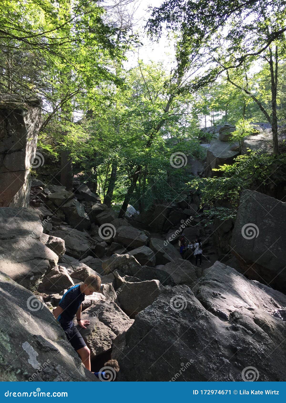 Climbing over the rocks stock image. Image of rock, rocks - 172974671
