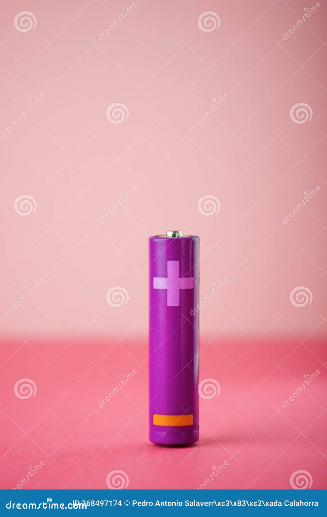 Purple AA Battery on a Pink Table Stock Photo - Image of electricity ...