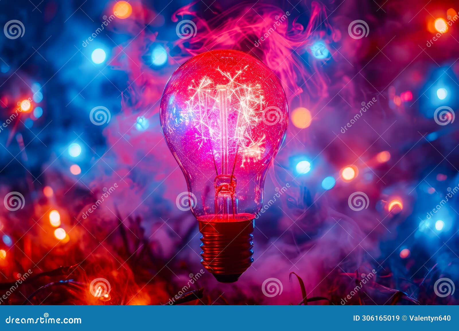 Purple and Blue Light Bulb with Filament Inside of it that is Lit Up ...