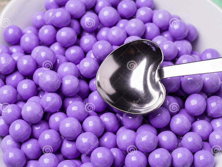 Purple Candy Covered Chocolates Stock Photo - Image of purple, flavored ...