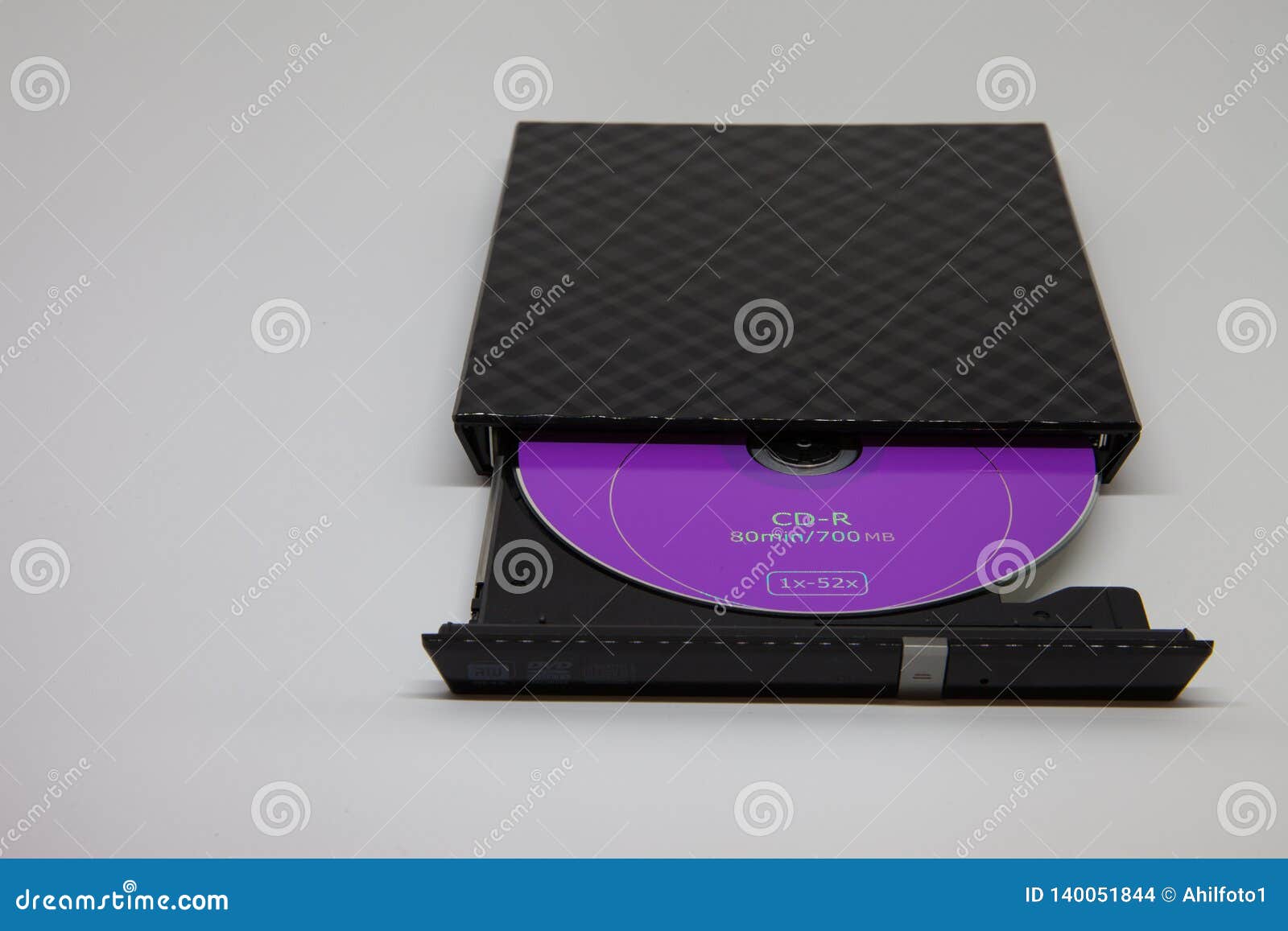 Purple Cd Disk in Black Drive. Stock Photo - Image of black, recording ...