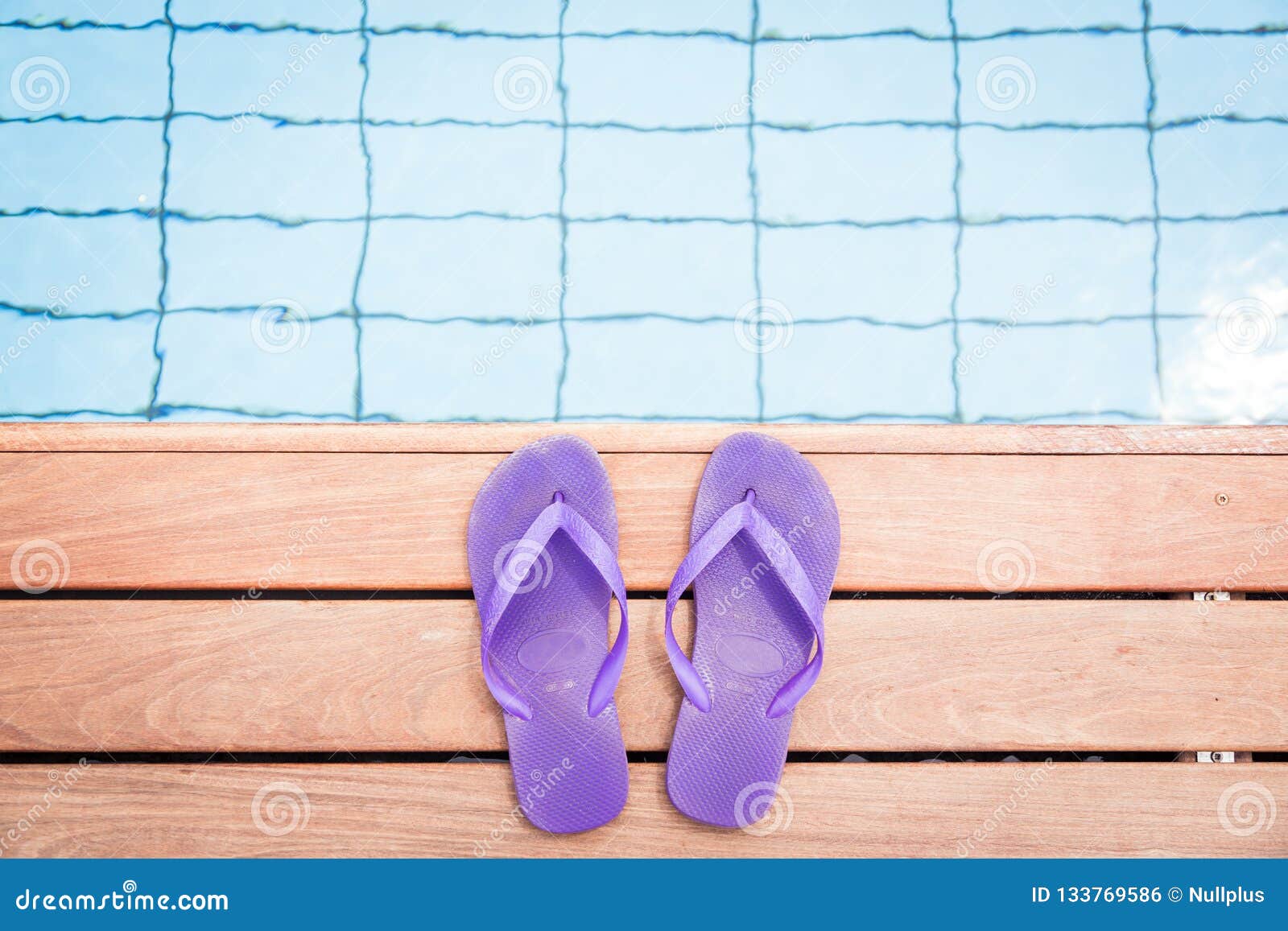Purple Flip Flops by the Pool Stock Photo - Image of shoe, outdoors ...