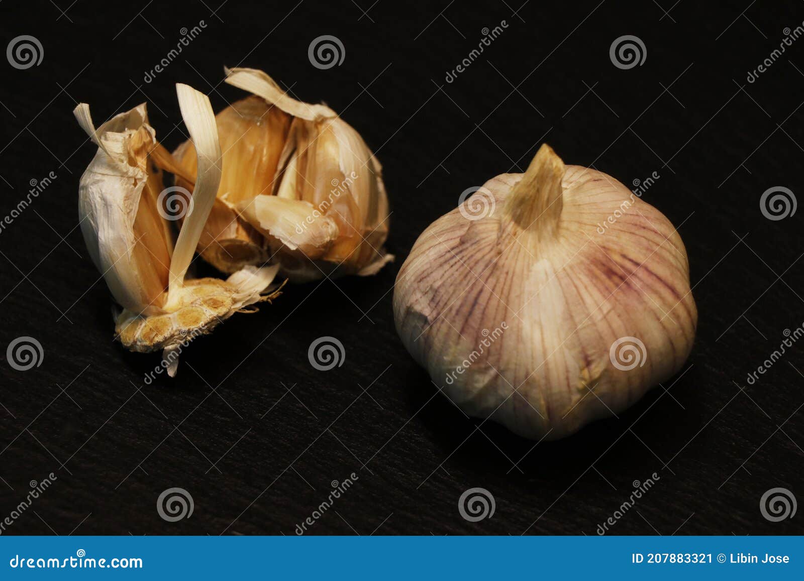 Purple Garlic Cloves Separately on a Black Background Stock Image ...