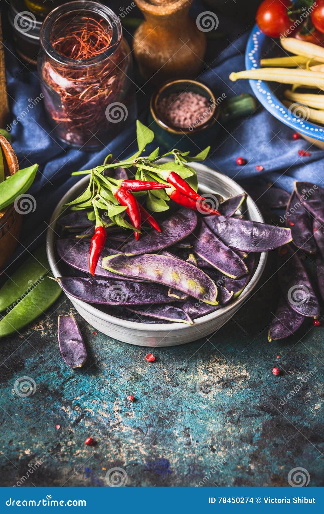 Purple Pea Pods with Cooking Ingredients in Bows on Rustic Kitchen ...