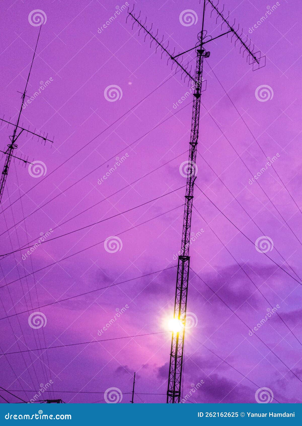 Purple Sky and only the Yellow Light between Towers Stock Image - Image ...
