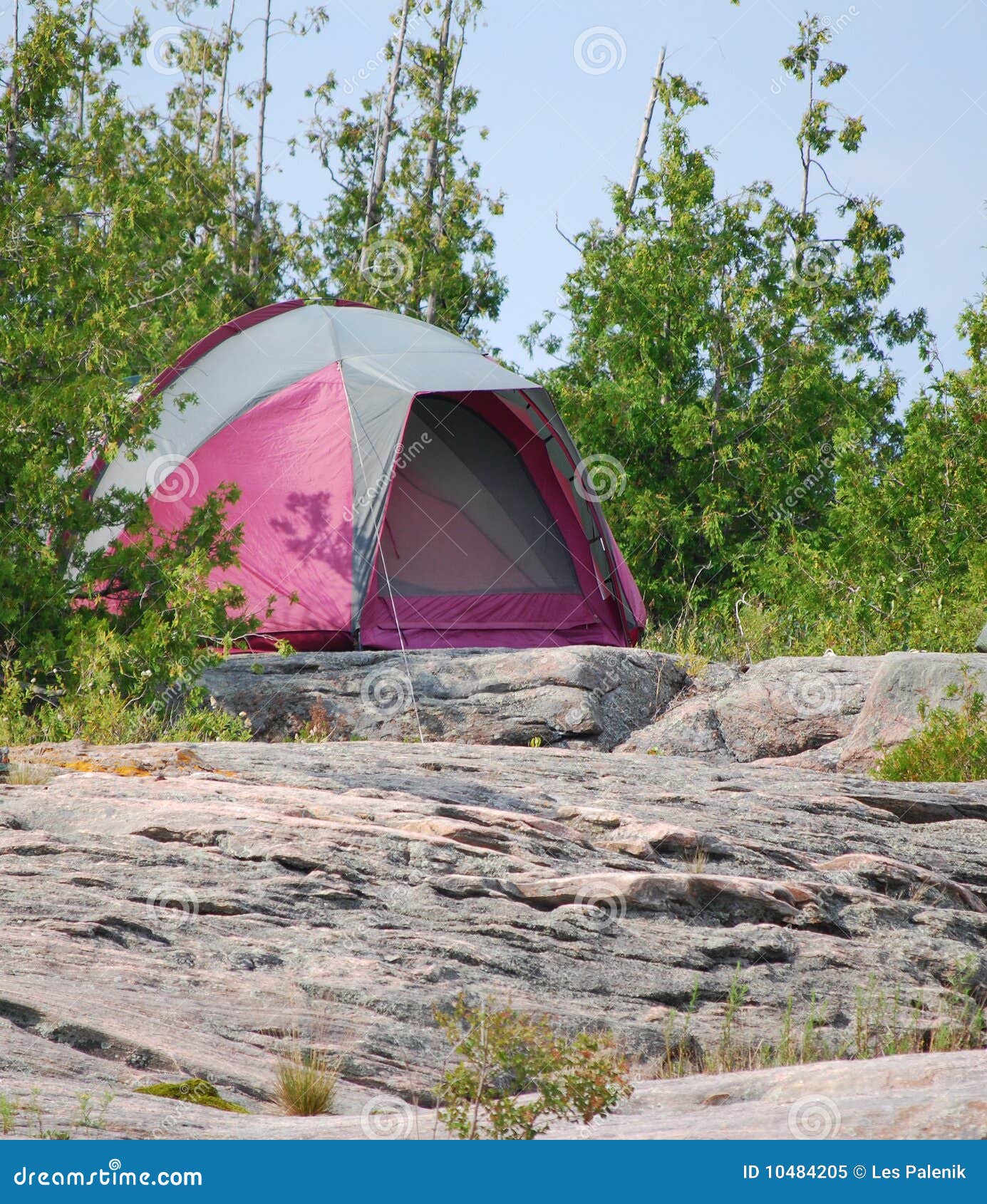 Purple tent on rocks stock image. Image of campsite, camping - 10484205