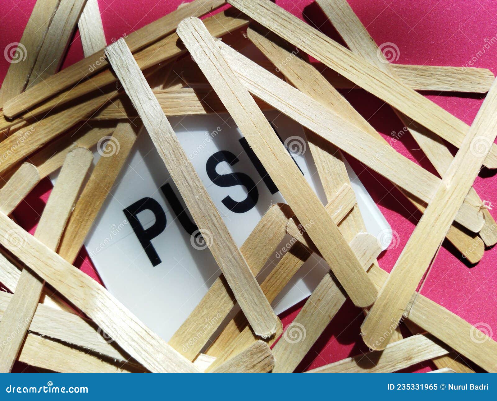 Push Sign Object Decorated with Several Wooden Sticks on a Red ...