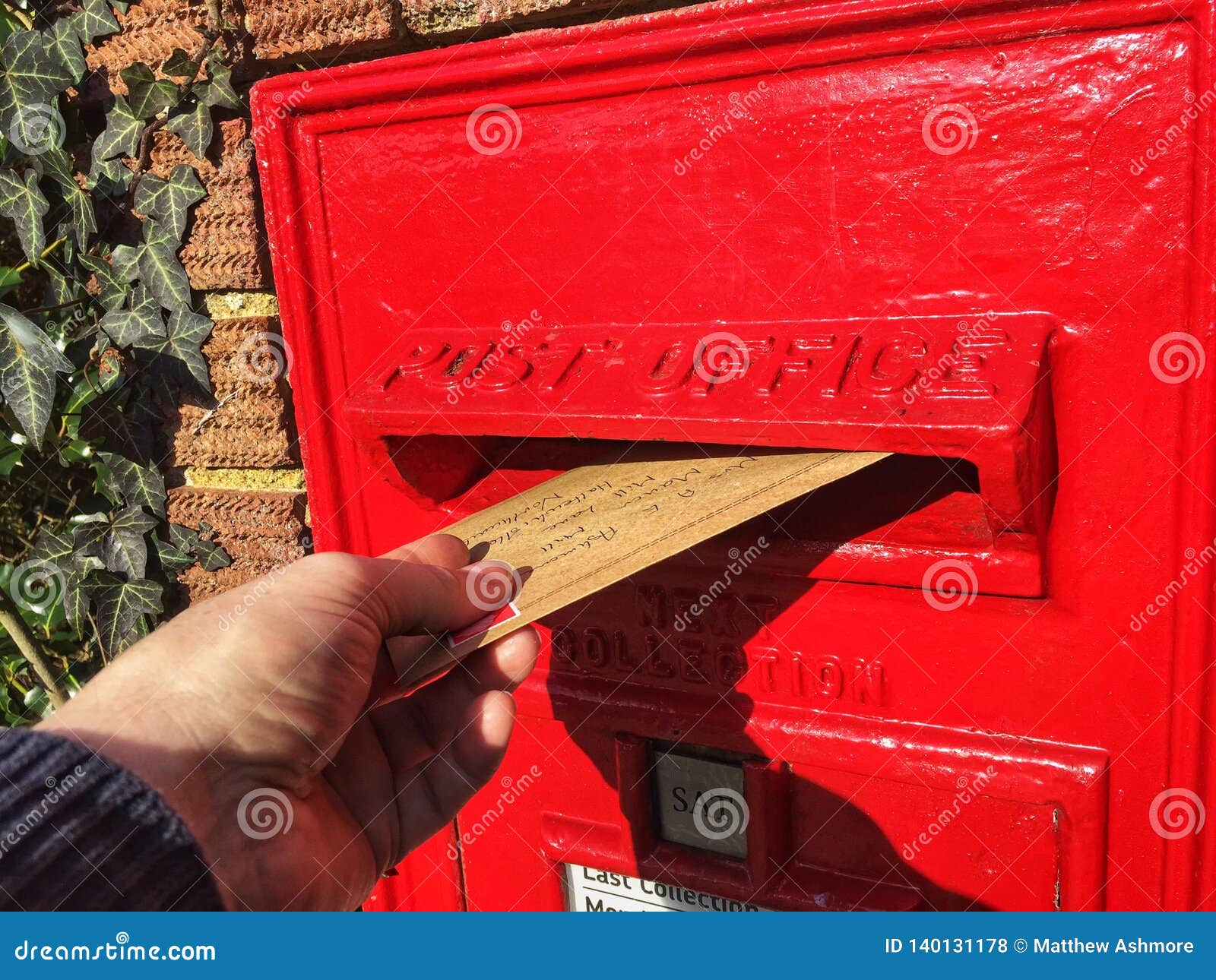 A Hand Posting a Letter in a Mail Box Editorial Stock Photo - Image of ...