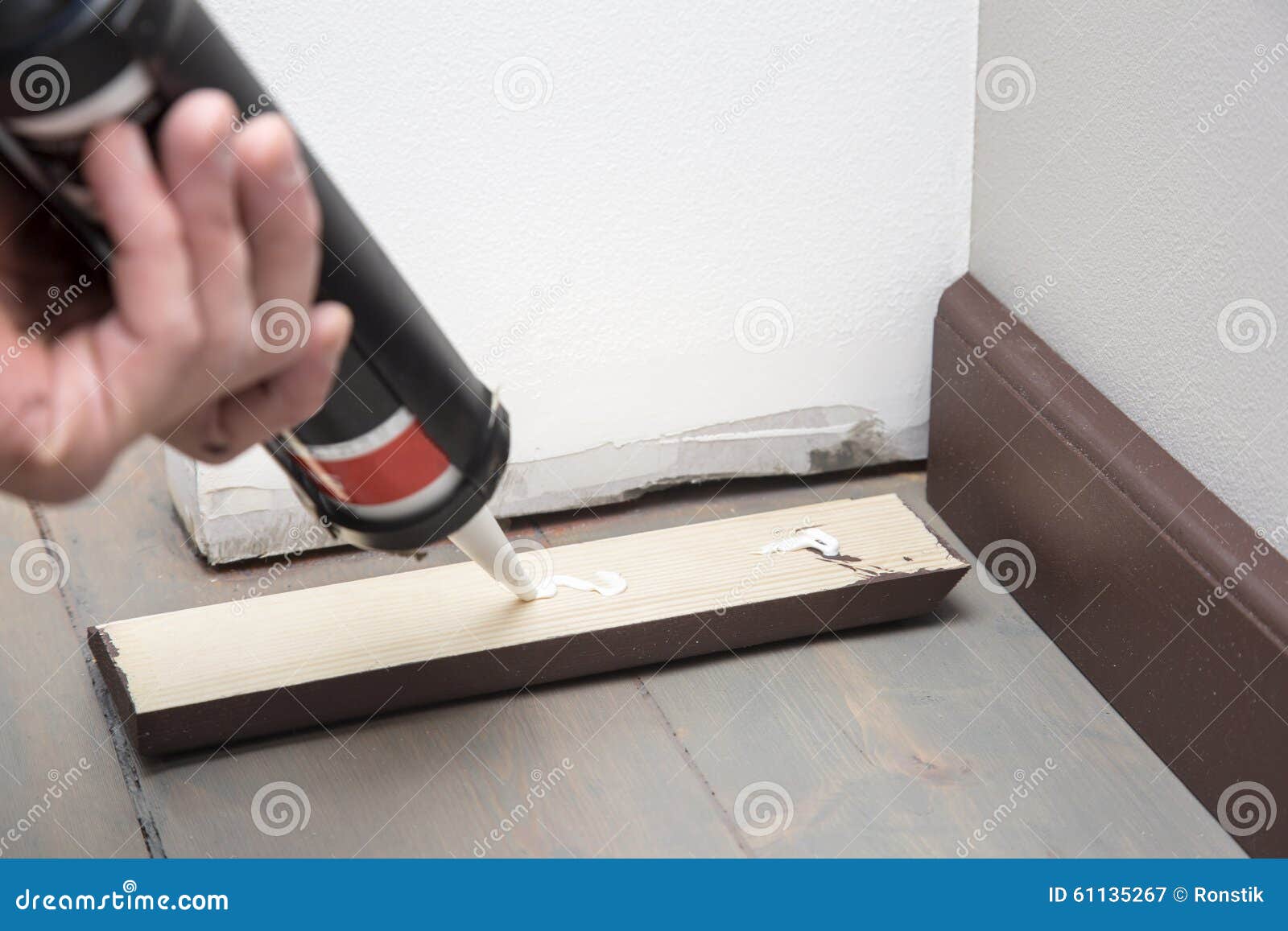 Pushing Glue on the Wooden Baseboard Stock Image - Image of baseboard ...