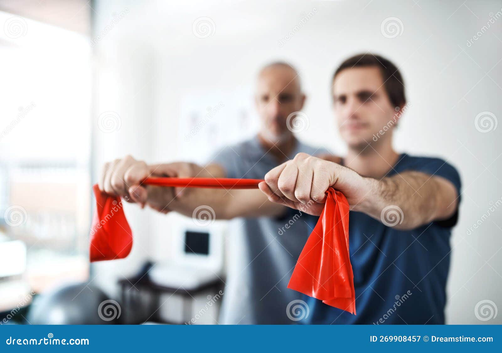 Pushing through His Challenges. a Physiotherapist Helping a Patient ...
