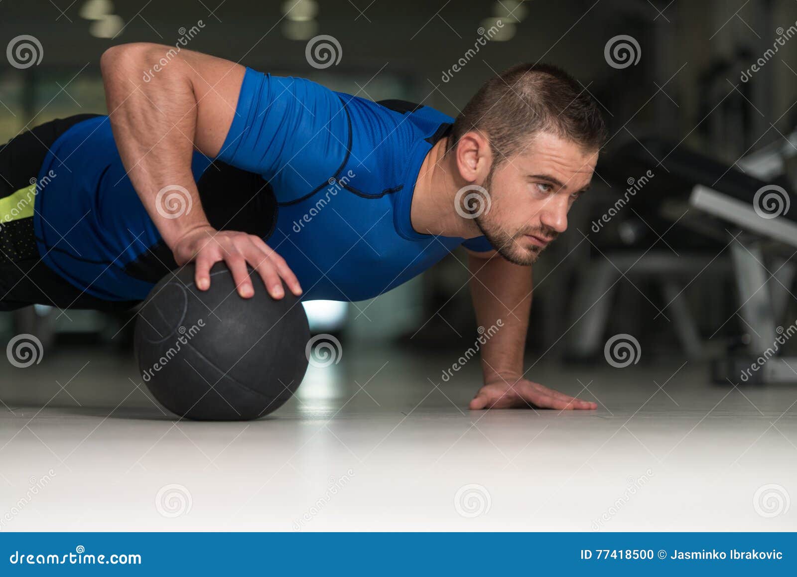 Pushups with Medicine Ball stock photo. Image of attractive - 77418500
