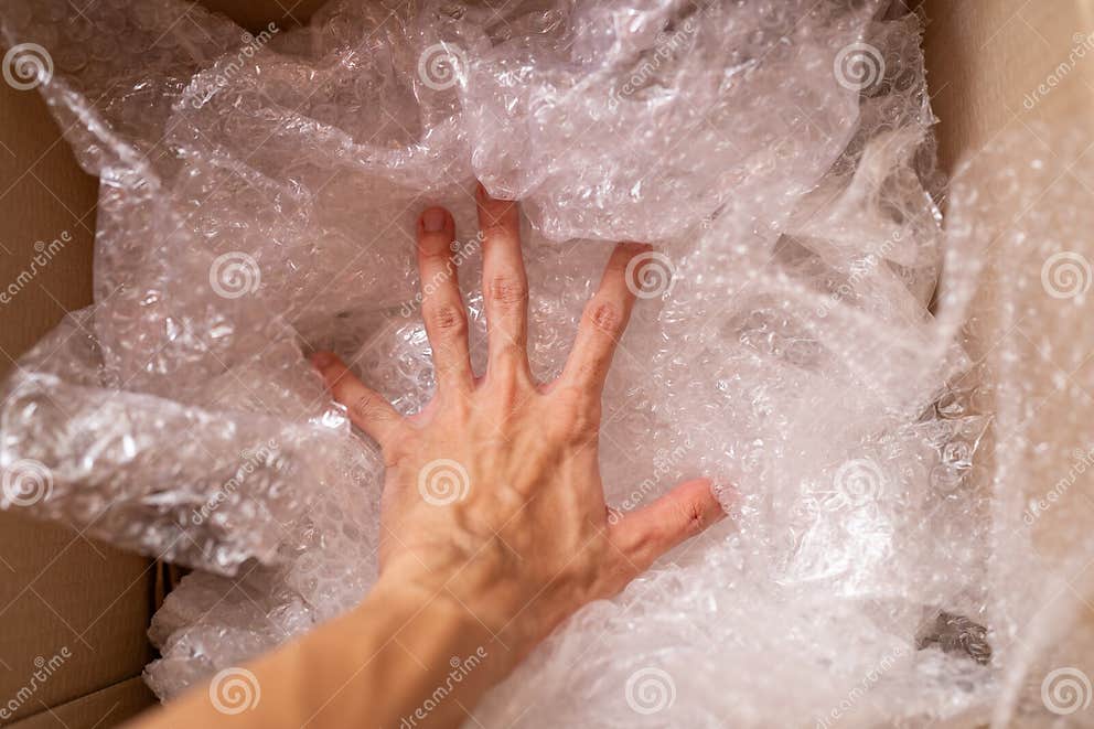 Put Bubble Wrap into a Cardboard Box Stock Image - Image of product ...