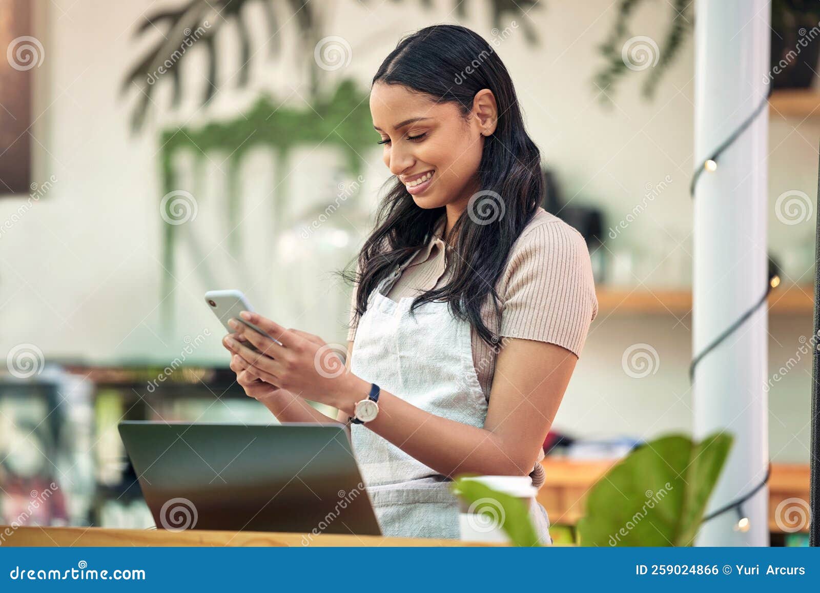 Put in those Orders Early. a Florist Using Her Smartphone To Send a ...