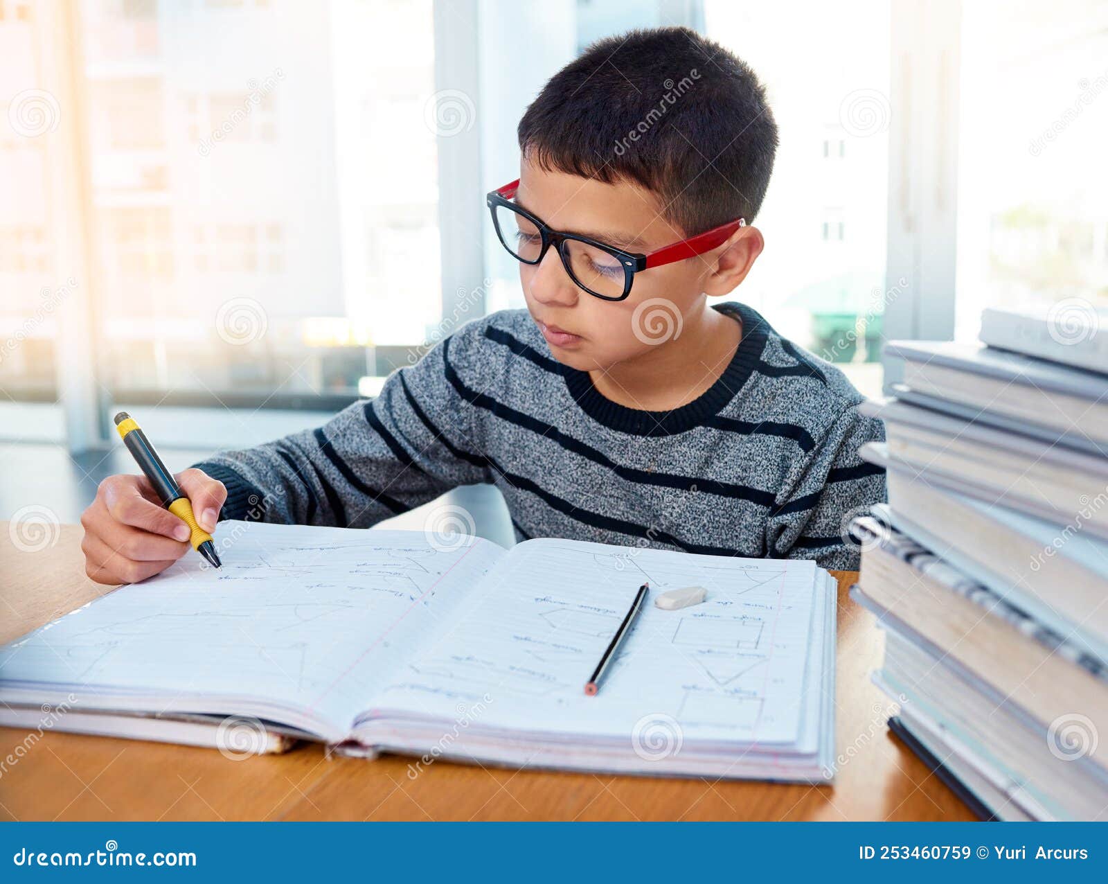 He always Puts His School Work First. a Determined Young Boy Doing His ...