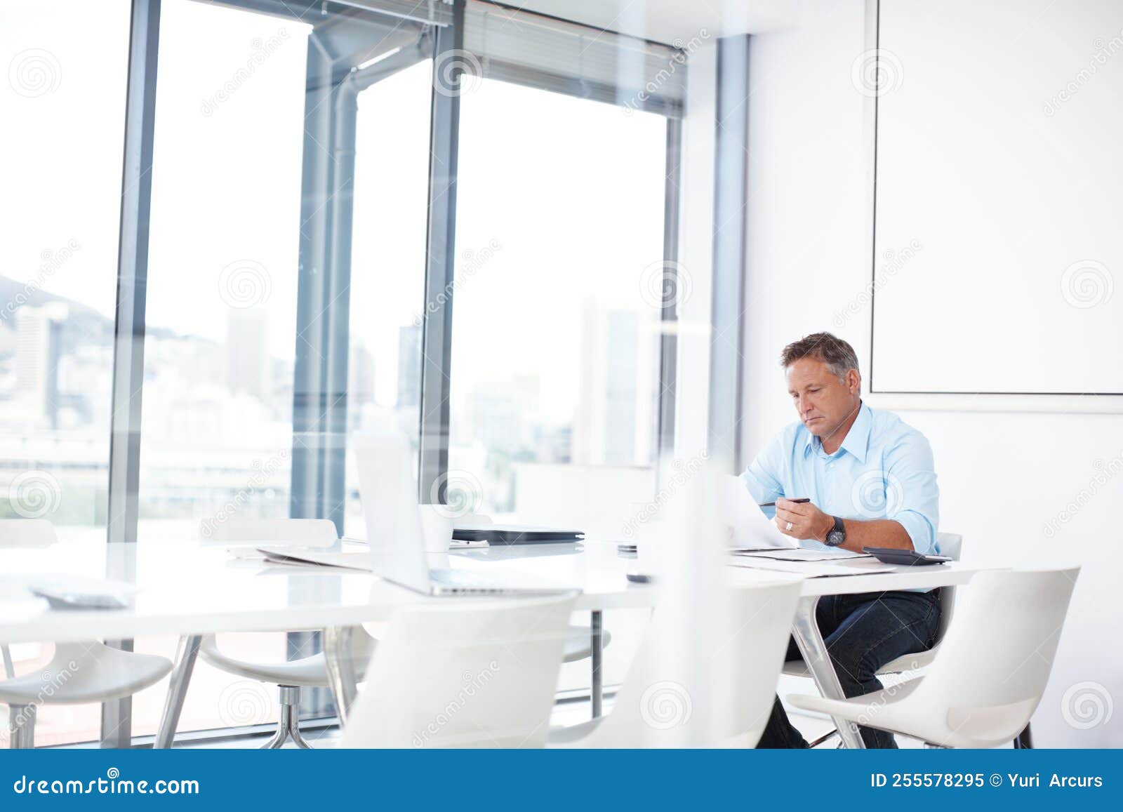 He Puts a Lot of Thought into His Work. a Mature Advertising Executive ...