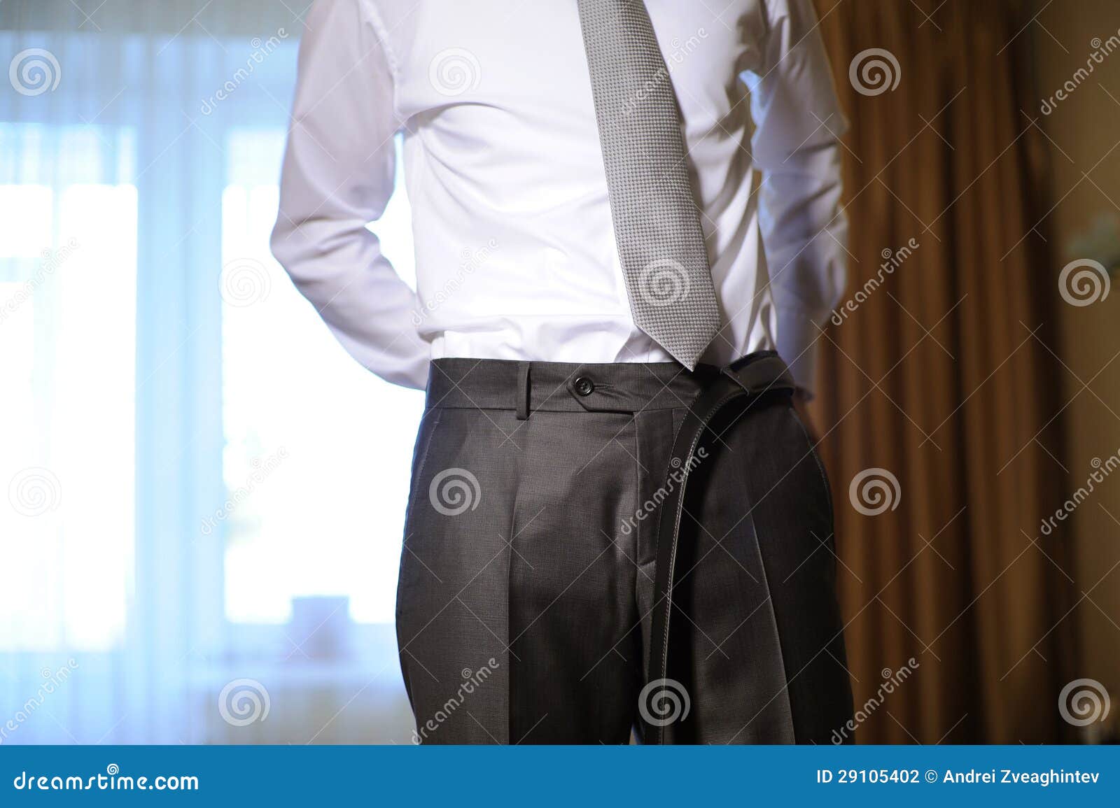 Putting on Belt stock photo. Image of collar, elegance - 29105402
