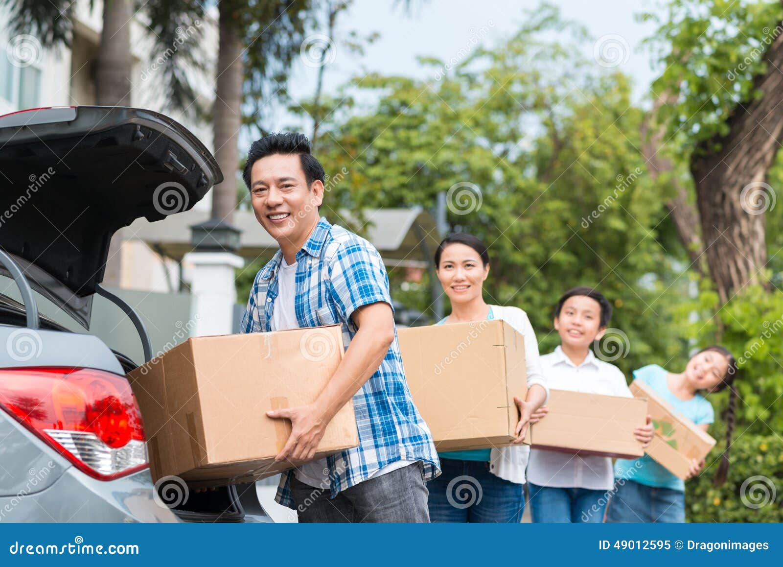 Putting boxes in the car stock image. Image of estate - 49012595