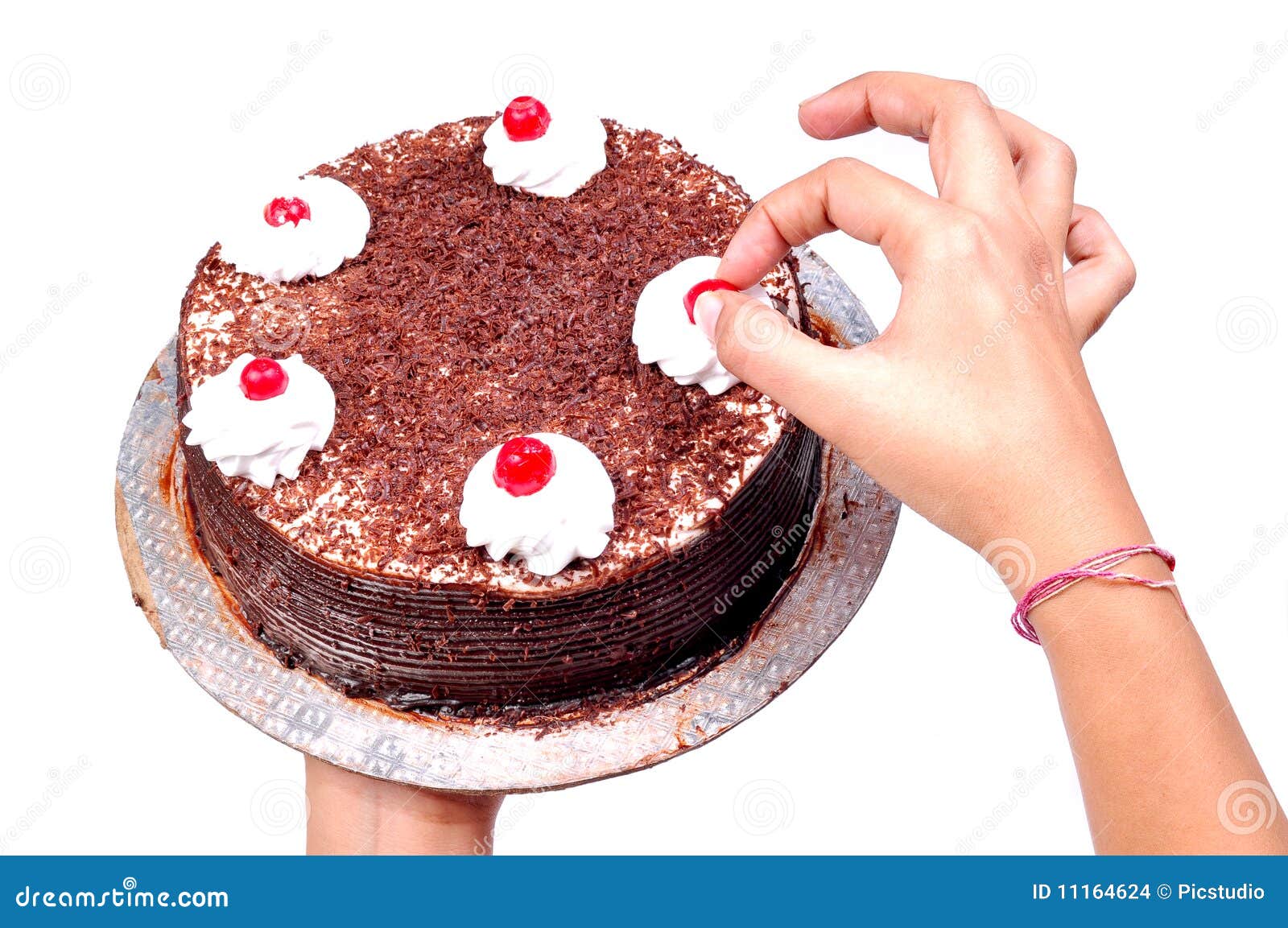 Putting cherry on cake stock photo. Image of celebrations - 11164624