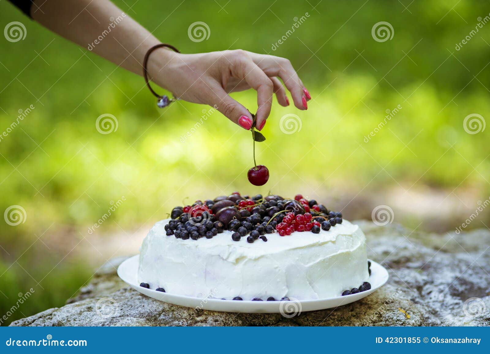 Putting cherry on the cake stock image. Image of fresh - 42301855