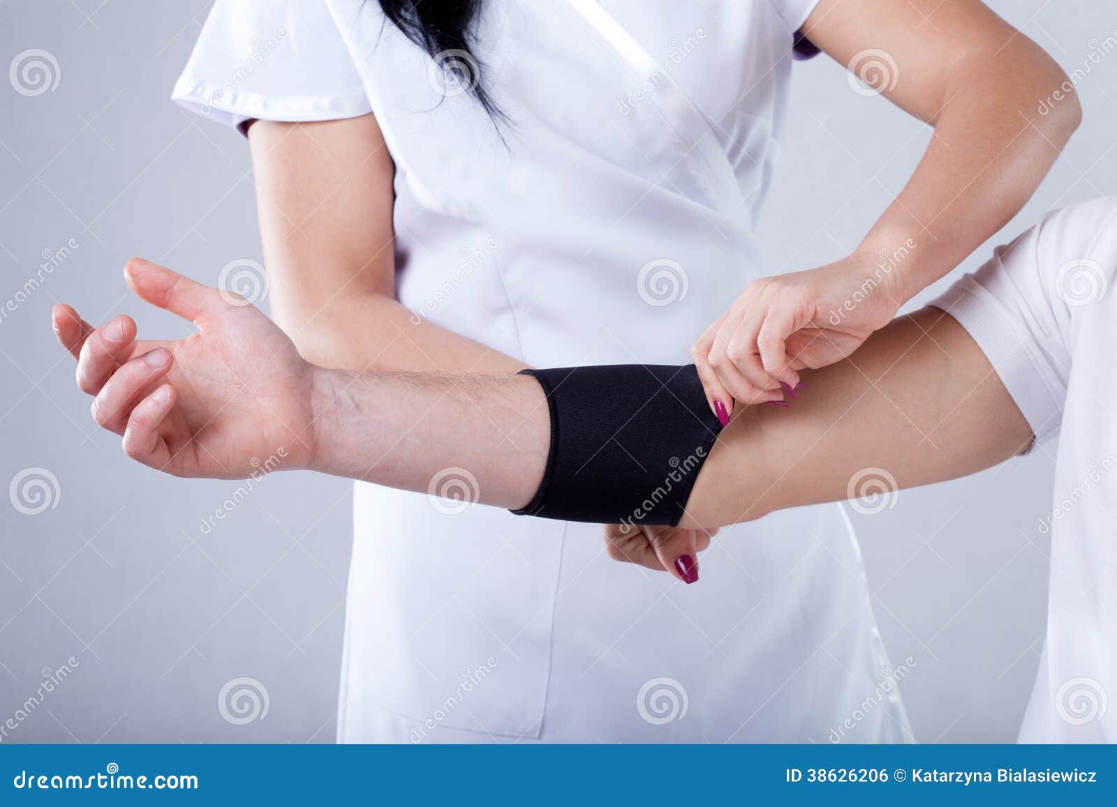 Putting on Compression Band Stock Photo - Image of doctor, activity ...