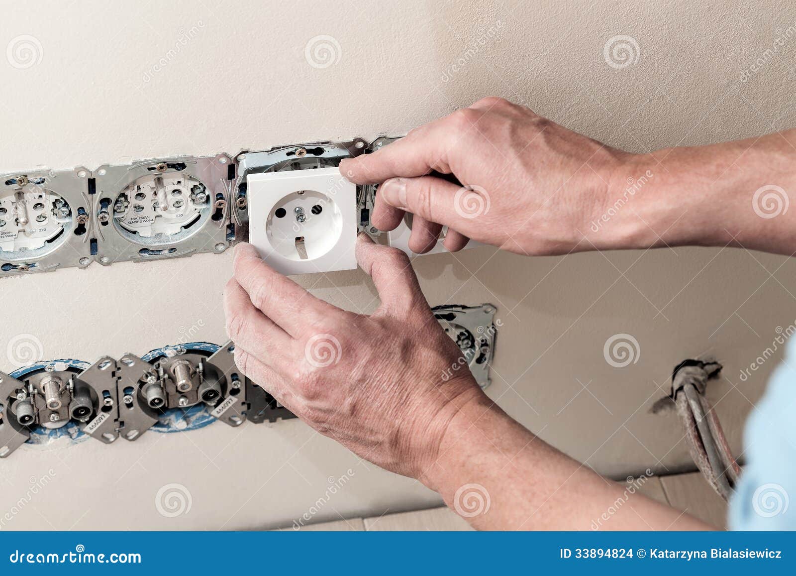 Putting cover on socket stock photo. Image of installing - 33894824