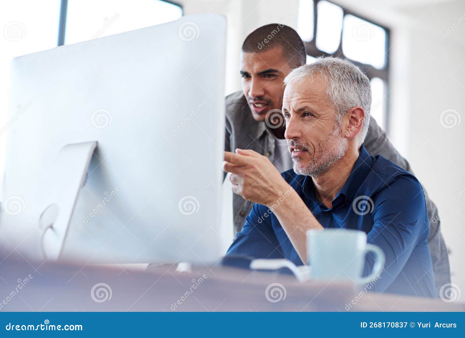 Putting His Ideas into Perspective. Two Designers Talking Together ...