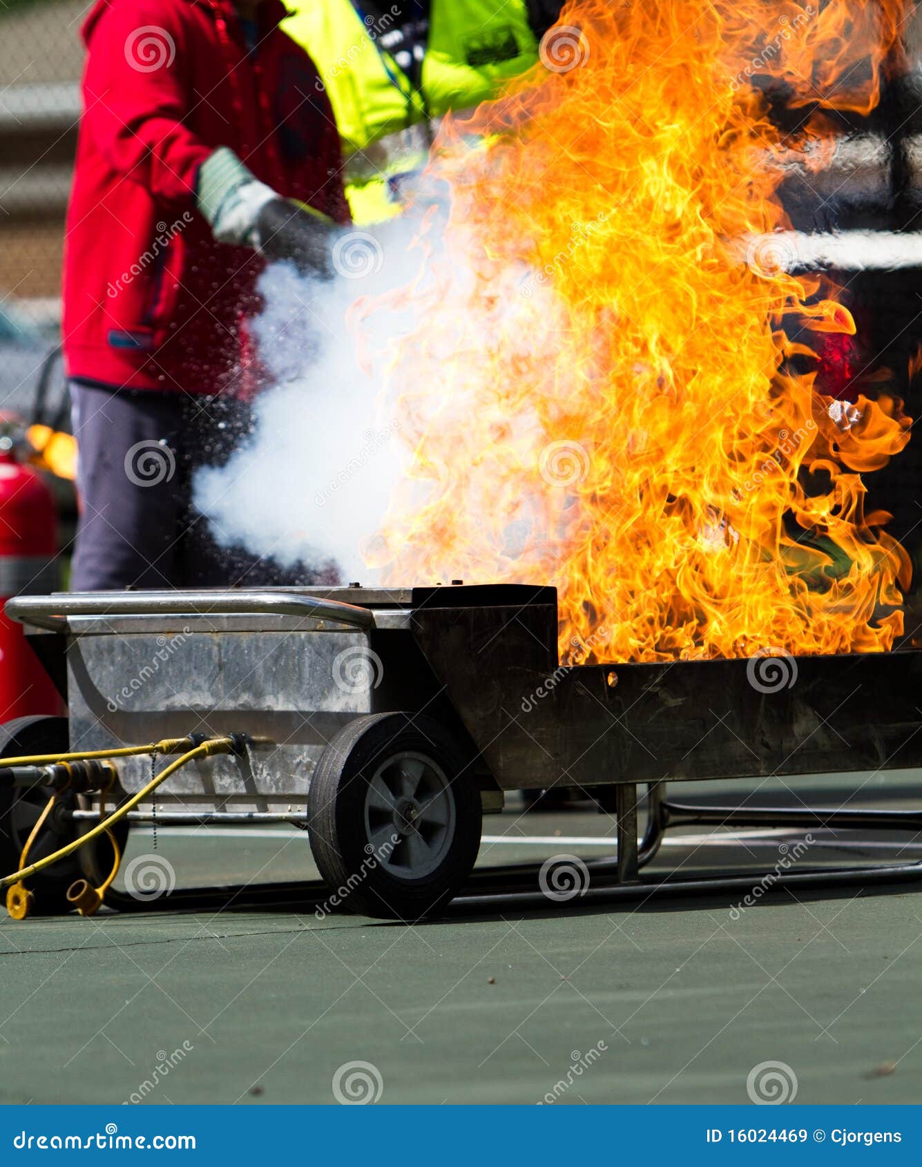 Putting out a fire stock image. Image of extinguisher - 16024469