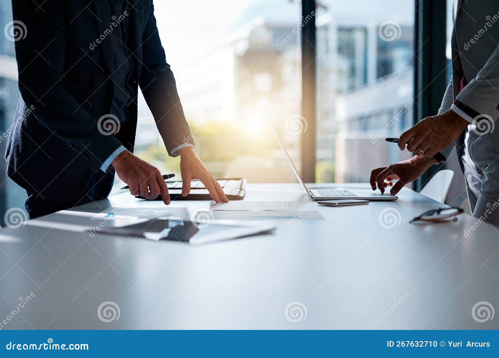 Putting the Paperwork in Perspective. Two Unrecognizable Businessmen ...