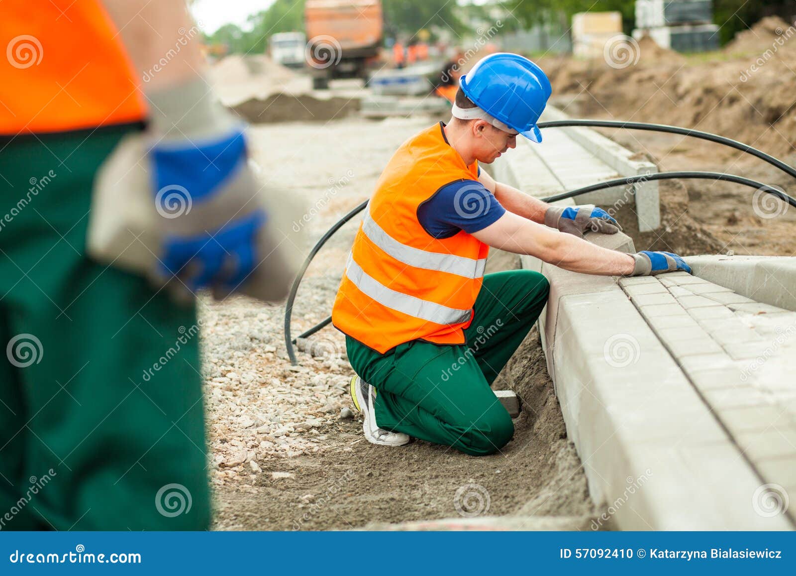 Putting paving stones stock photo. Image of brick, construction - 57092410