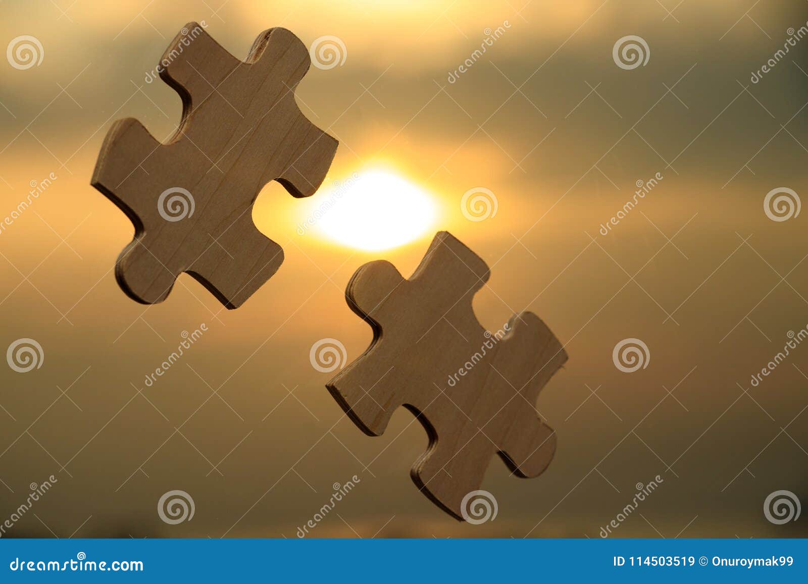 Putting Puzzle Pieces Together on Sky Background with Sunlight Stock ...
