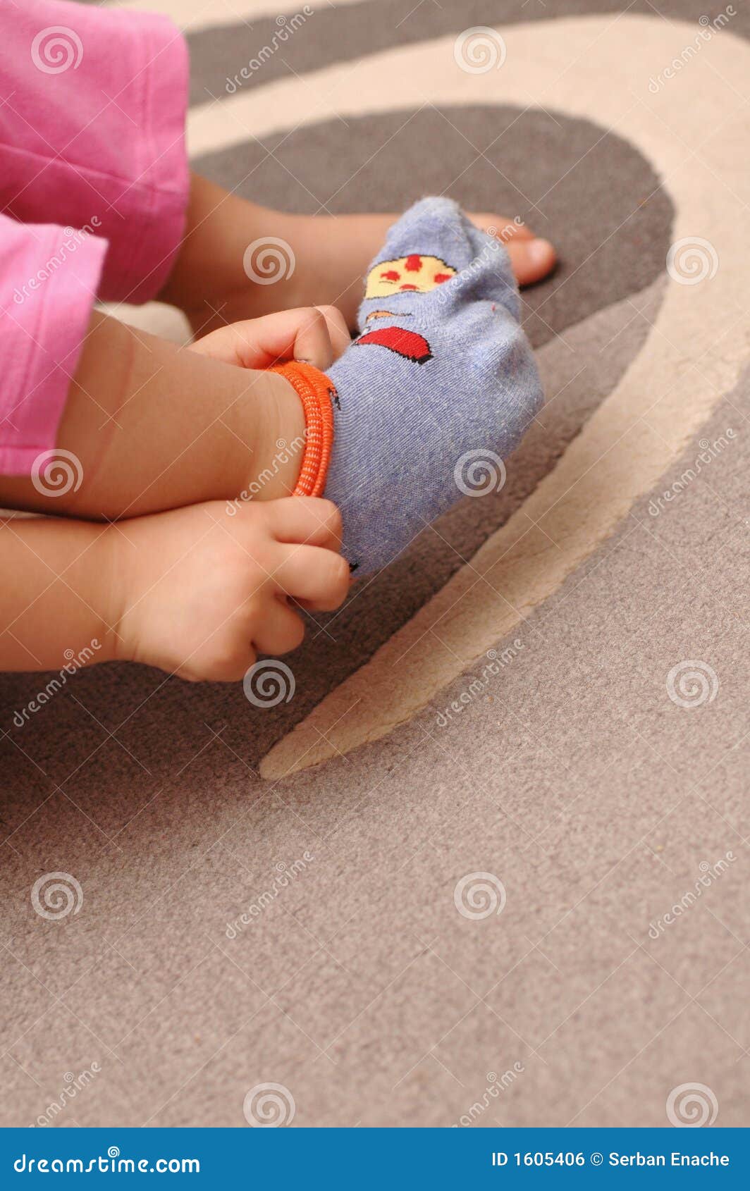 Putting on Socks stock photo. Image of learning, socks - 1605406
