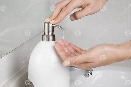 Putting some soap on hands stock image. Image of bathroom - 11368361