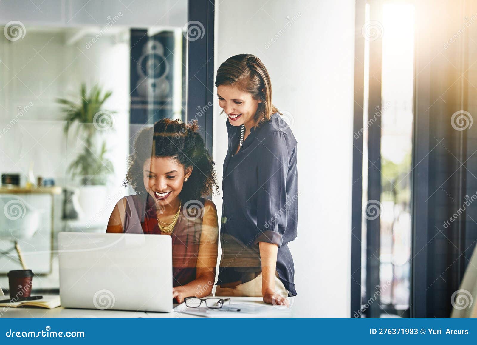 Putting Some Solid Plans into Place. Two Businesswomen Working Together ...