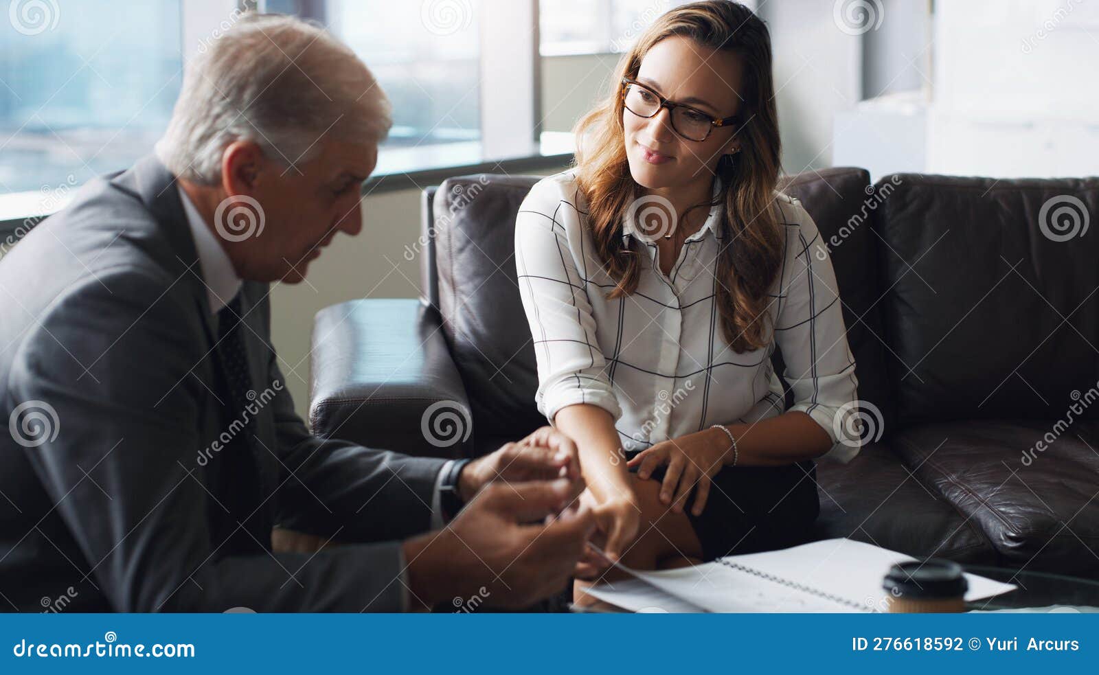 Putting Their Ideas Together. Two Businesspeople Having a Discussion ... Putting Their Ideas Together. Two Businesspeople Having a Discussion ...