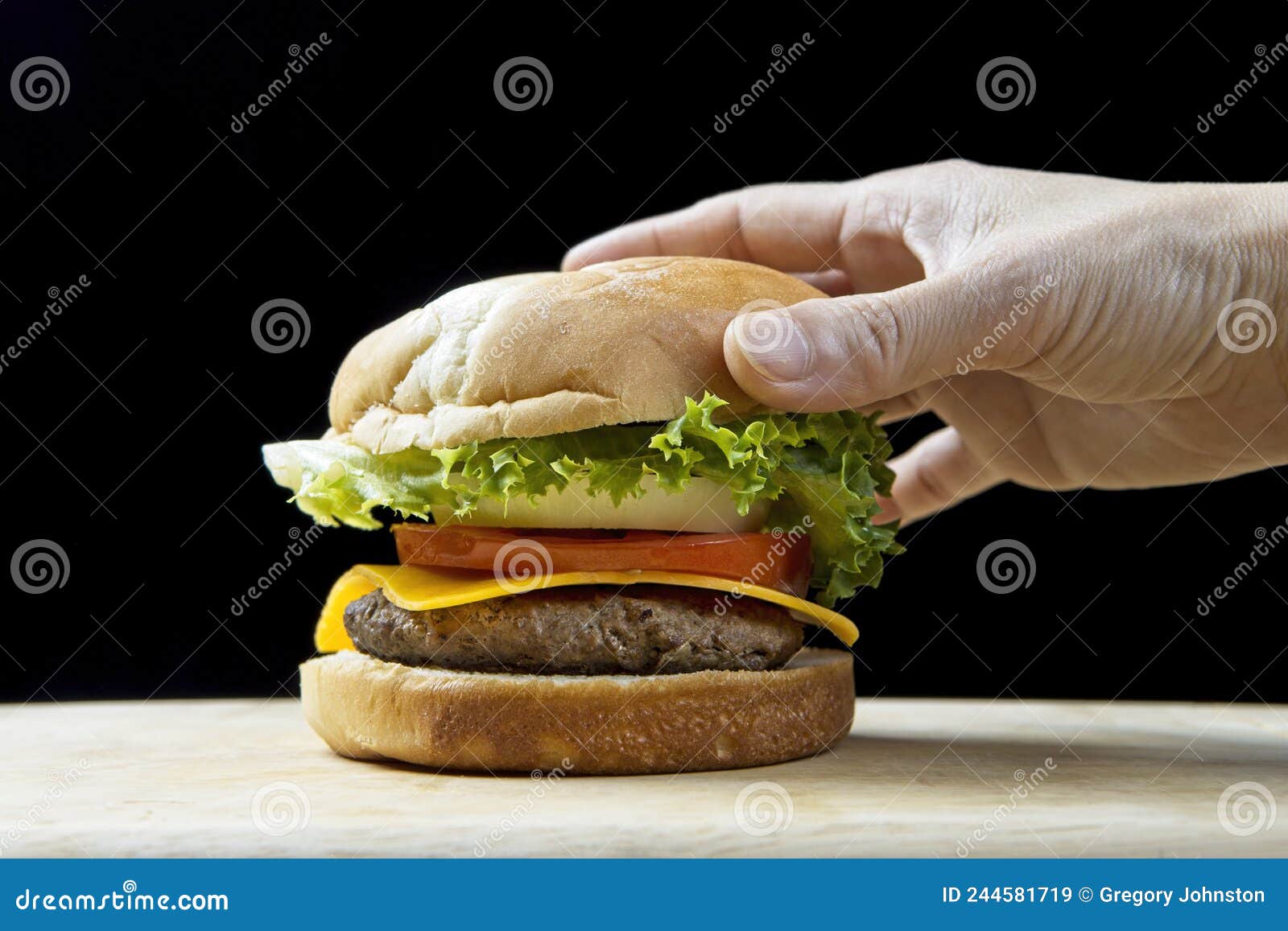 Putting the Top Bun on a Burger Stock Image - Image of hamburger ...
