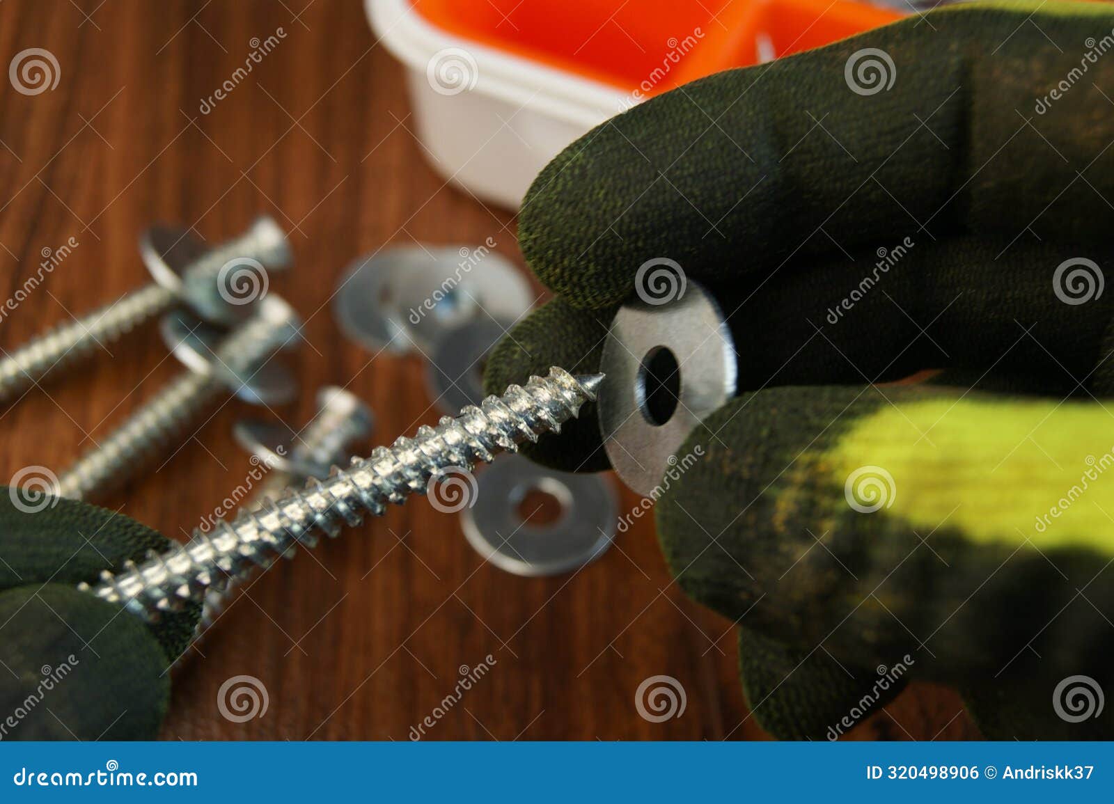 Builder S Work Process. Putting the Washer on the Screw. Stock Photo ...