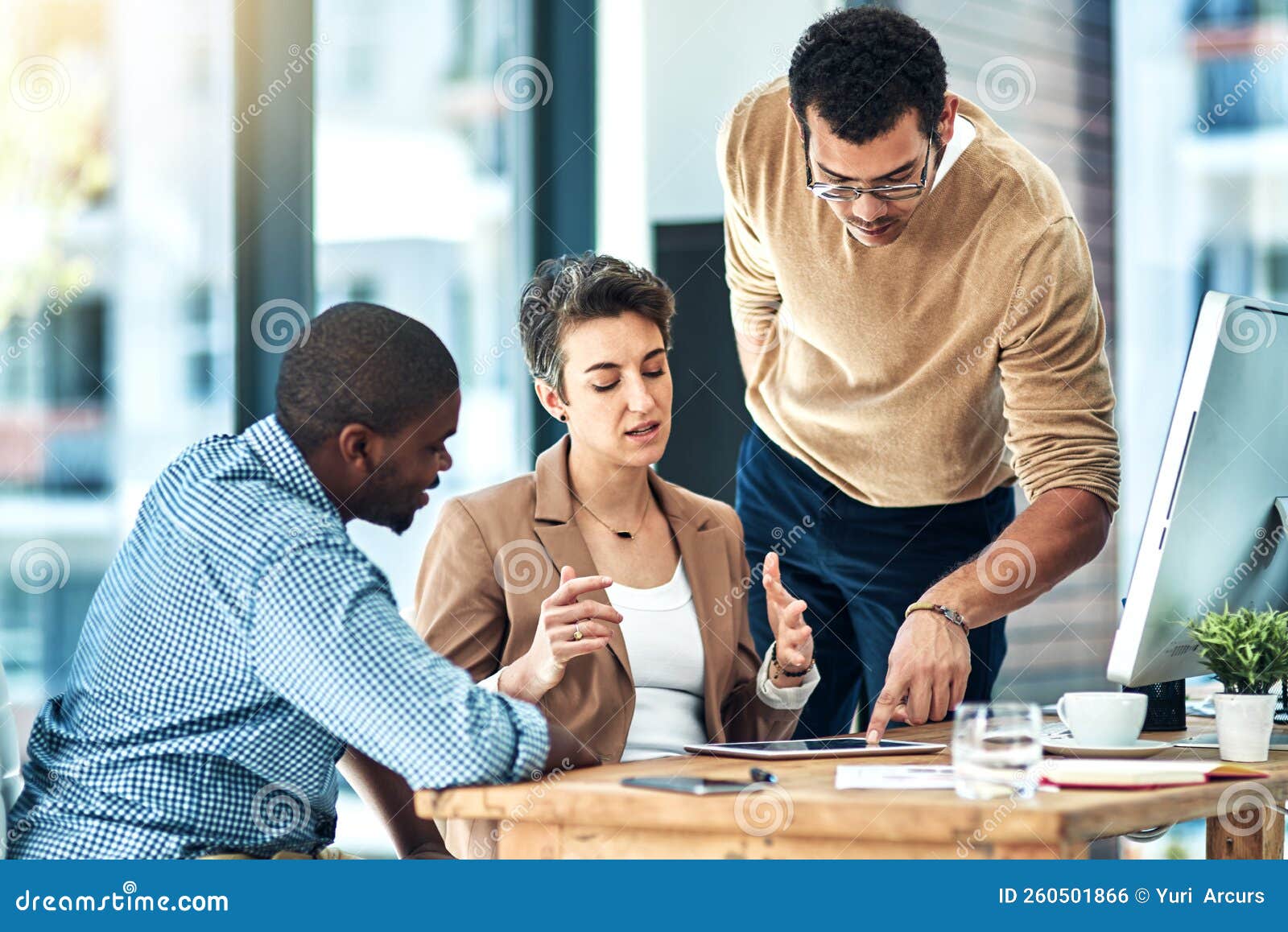 Putting in the Work To Succeed. Three Designers Having a Brainstorming ...