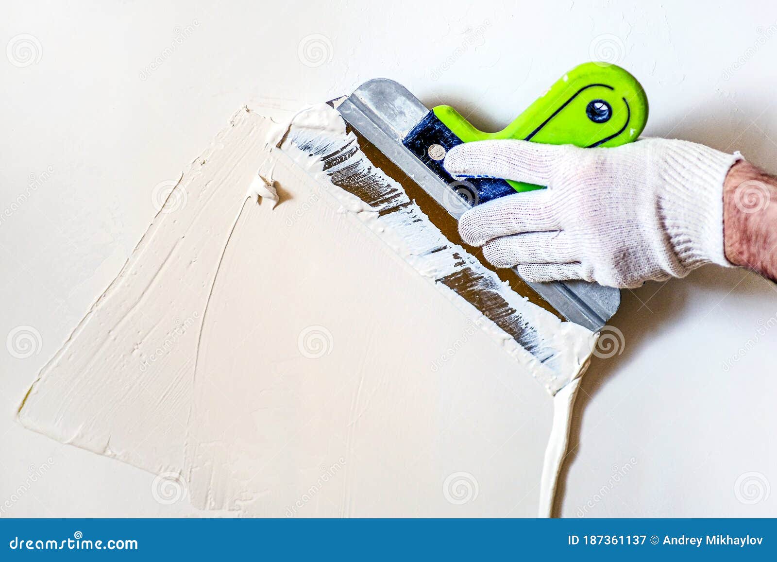 Putty is Applied with a Spatula. the Plasterer Puts the Plaster on the ...
