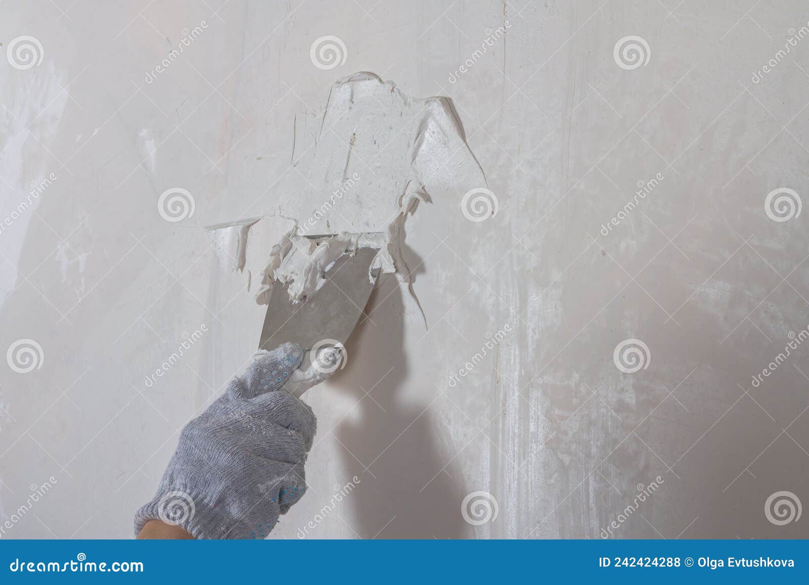 Putty the Wall in the House with Putty Using a Spatula To Level the ...