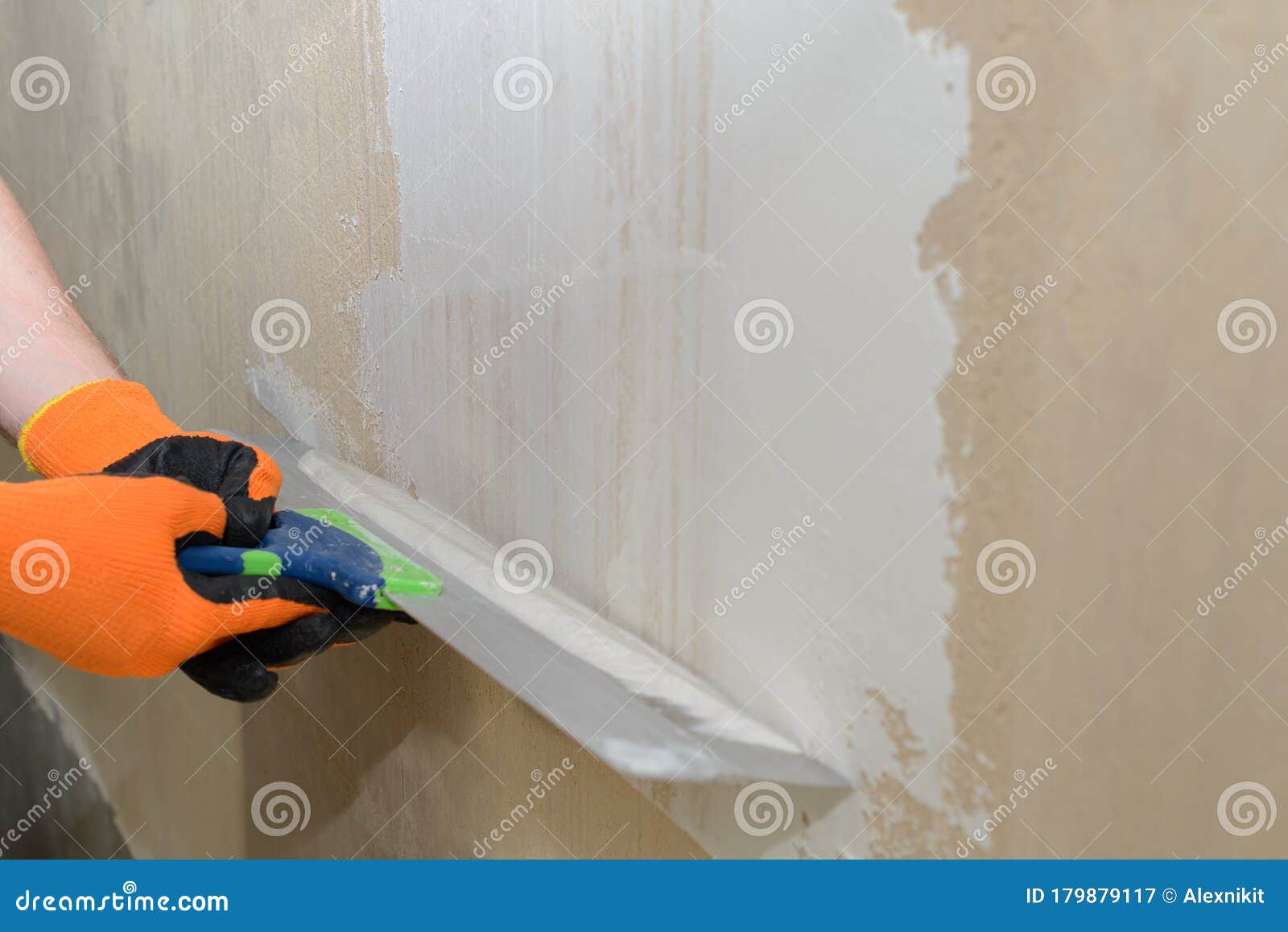 Puttying the Wall with Plaster Putty Using a Wide Spatula Stock Image ...