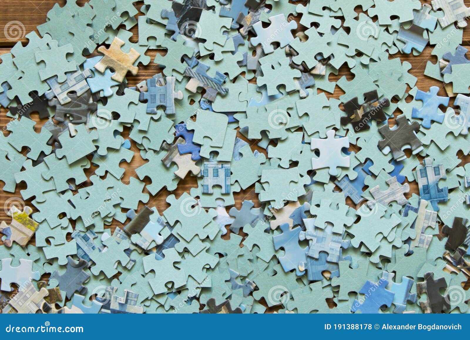 Puzzle. Many Puzzle Pieces on a Wooden Table Stock Photo - Image of ...